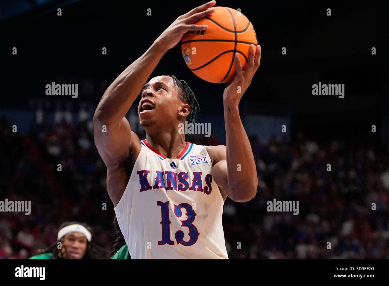 Kansas guard Elmarko Jackson shoots during the first half of an NCAA ...