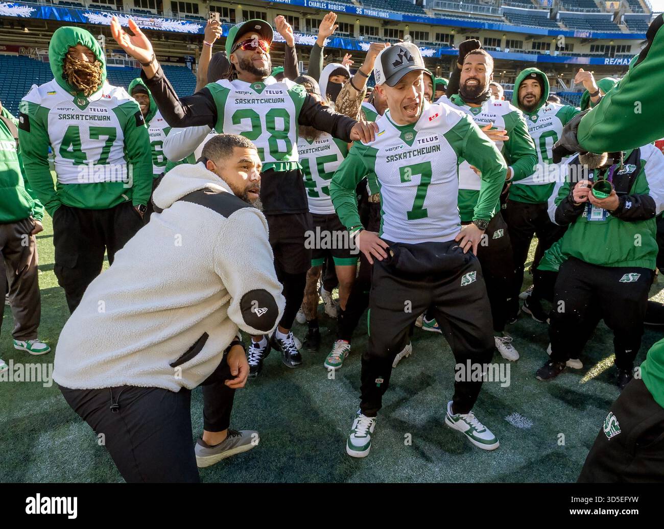 Saskatchewan Roughriders head coach Corey Mace (left) and quarterback ...