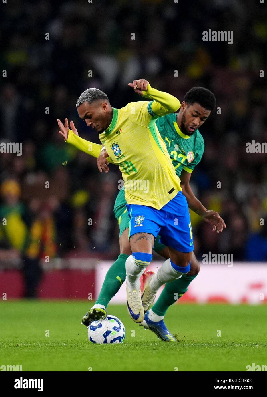 Senegal's Ibrahim Mbaye (left) and Brazil's Wesley (right) battle for ...