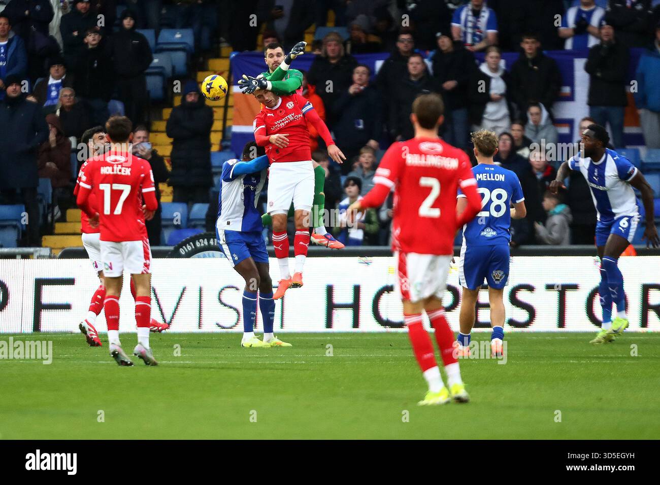 Mathew Hudson, Goalkeeper of Oldham Athletic goes for the high ball ...