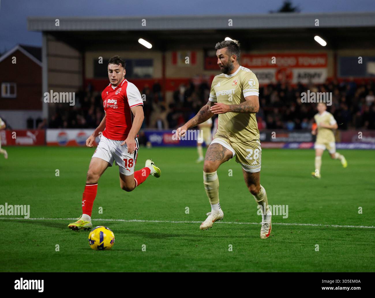 Fleetwood Town's Harrison Holgate (left) and Swindon Town's Ollie ...