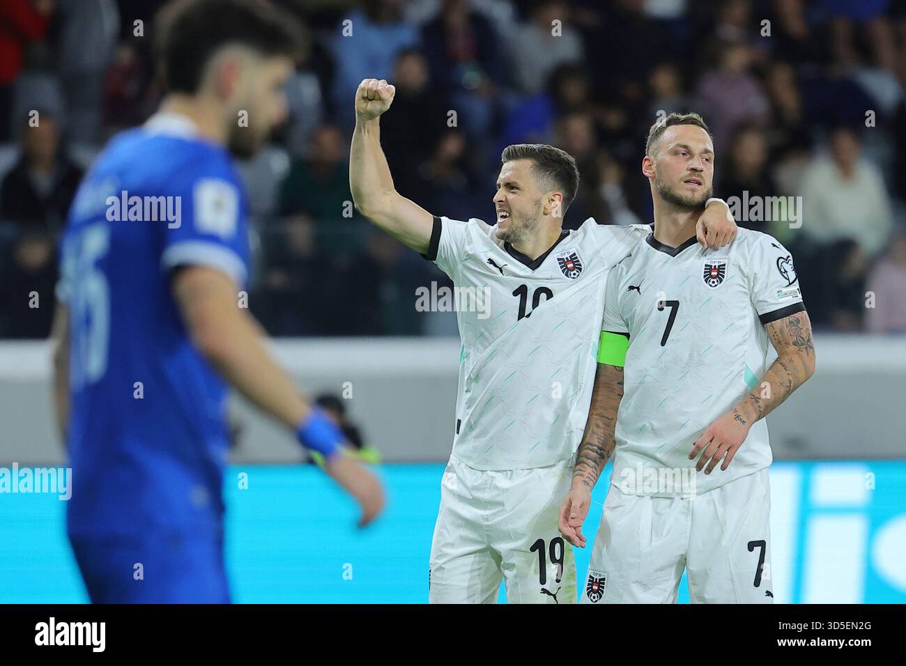 Austria's Marko Arnautovic, right, celebrates with Florian Grillitsch ...