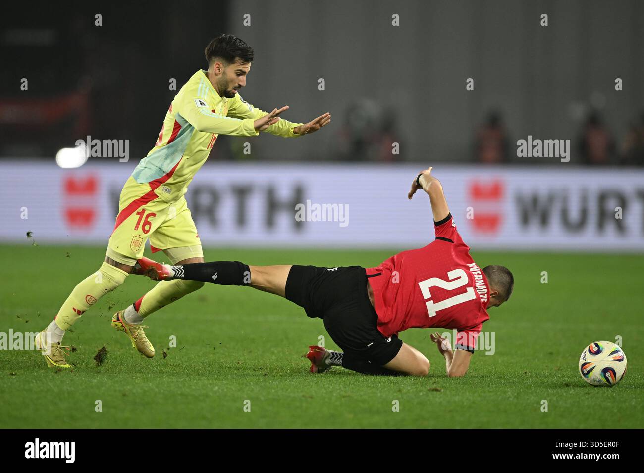 Spain's Alex Baena, left, fights for the ball with Georgia's Giorgi ...
