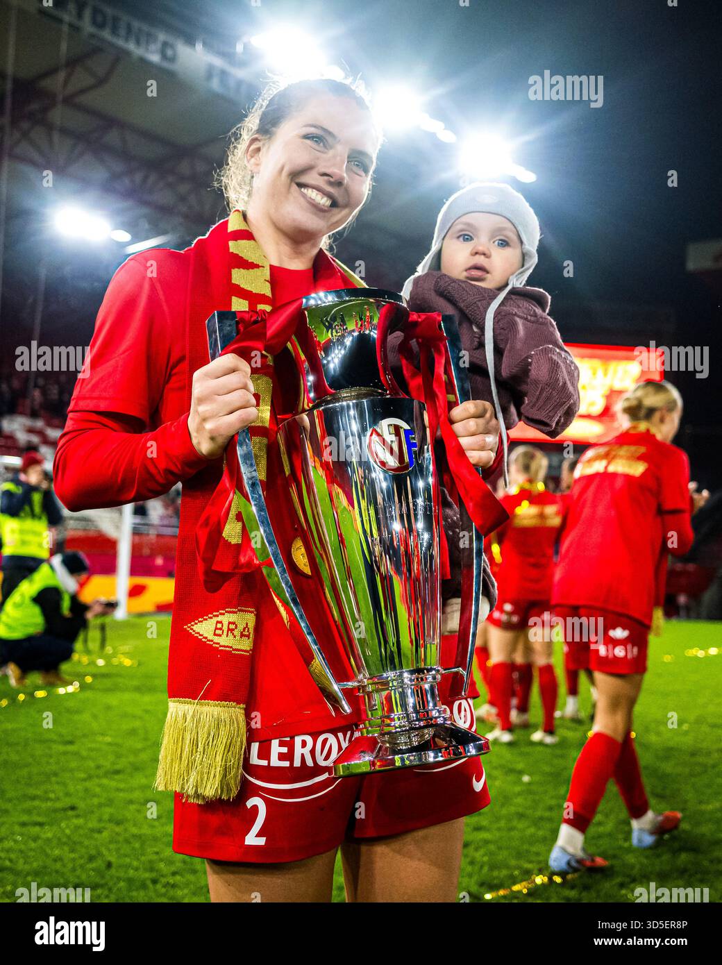 251115 Cecilie Redisch Kvamme of Brann celebrates with the trophy after ...