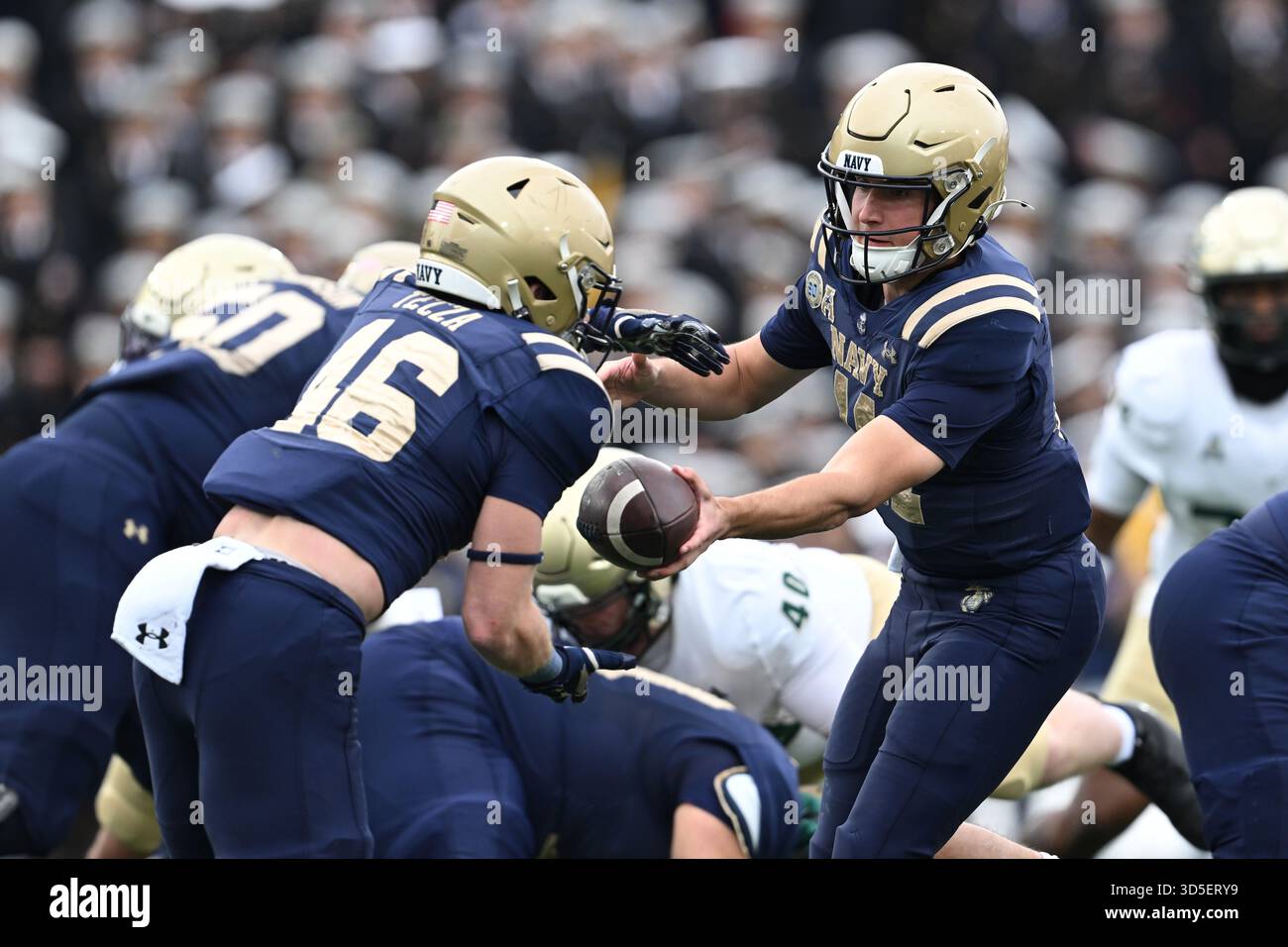 Navy quarterback Blake Horvath (11) hands off to fullback Alex Tecza ...