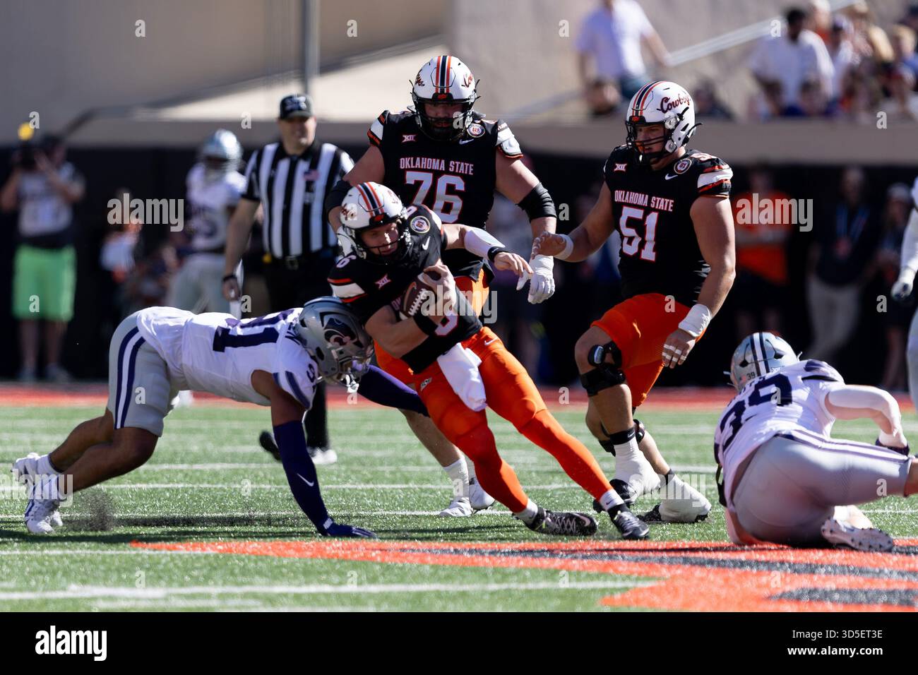 Oklahoma State quarterback Zane Flores (6) is tackled by Kansas State ...