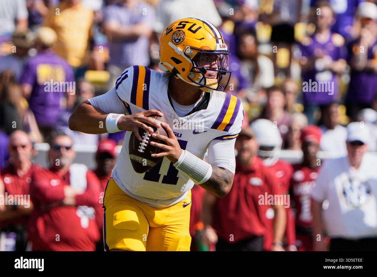 LSU quarterback Michael van Buren Jr. (11) scrambles against Arkansas ...