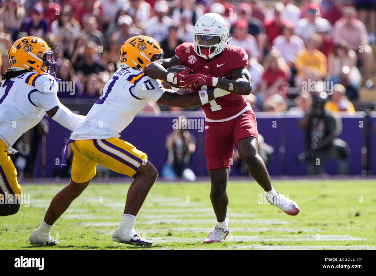 Arkansas running back Rodney Hill (1) carries against LSU safety ...