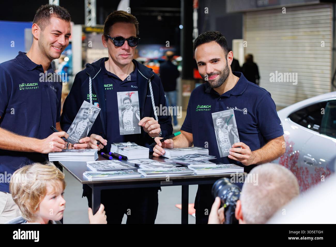 Racing drivers sign autograph cards featuring Carlos Rivas, Dylan ...