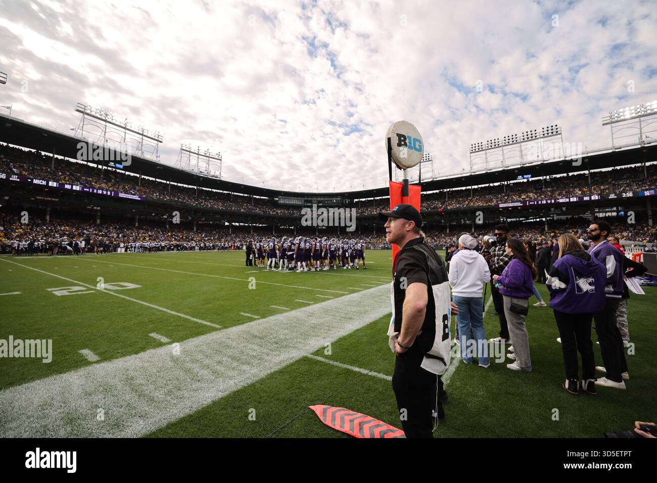 CHICAGO, ILLINOIS - NOVEMBER 15: Teams huddle during the college ...