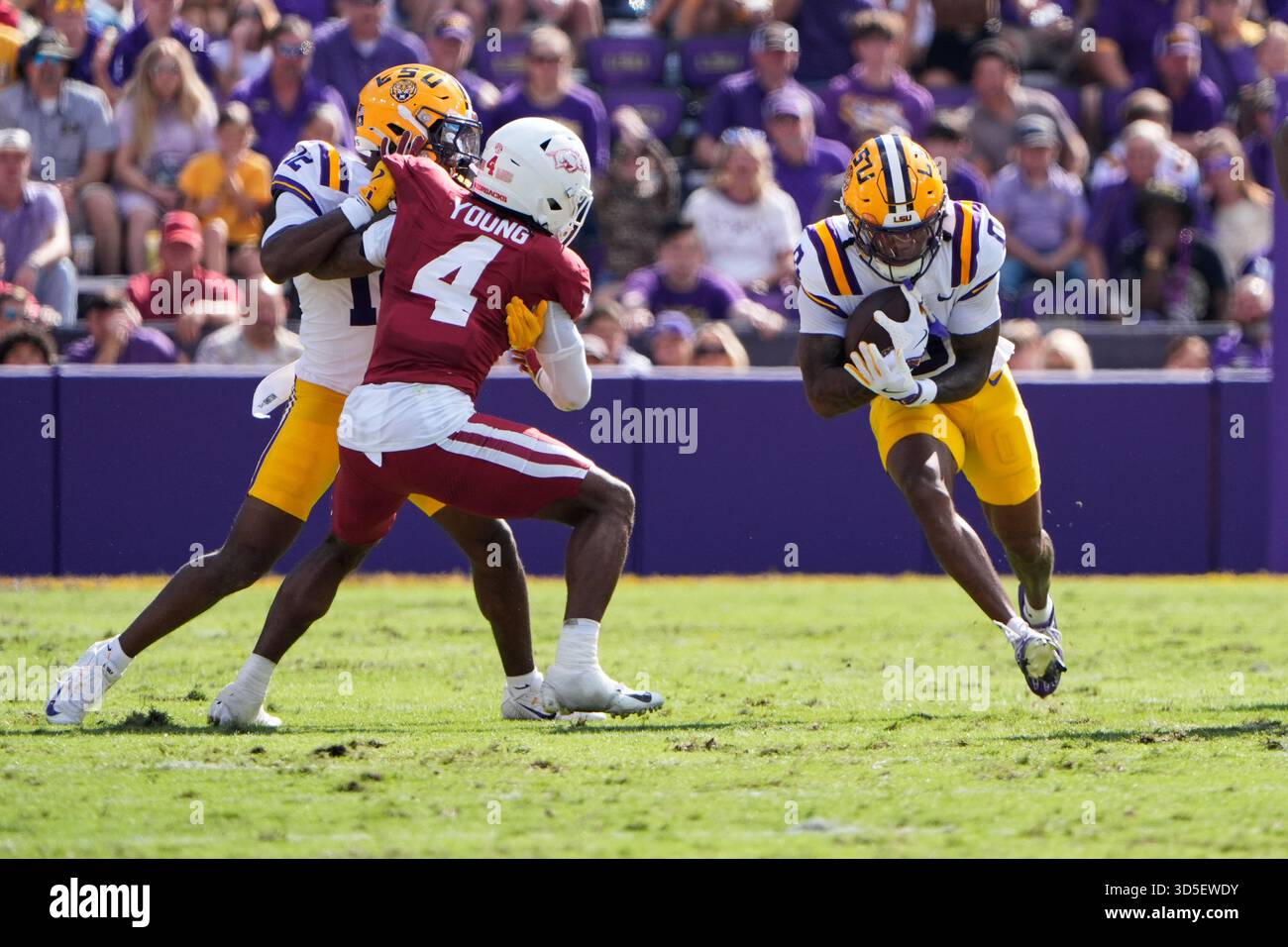 LSU wide receiver Zavion Thomas (0) carries as wide receiver Kyle ...