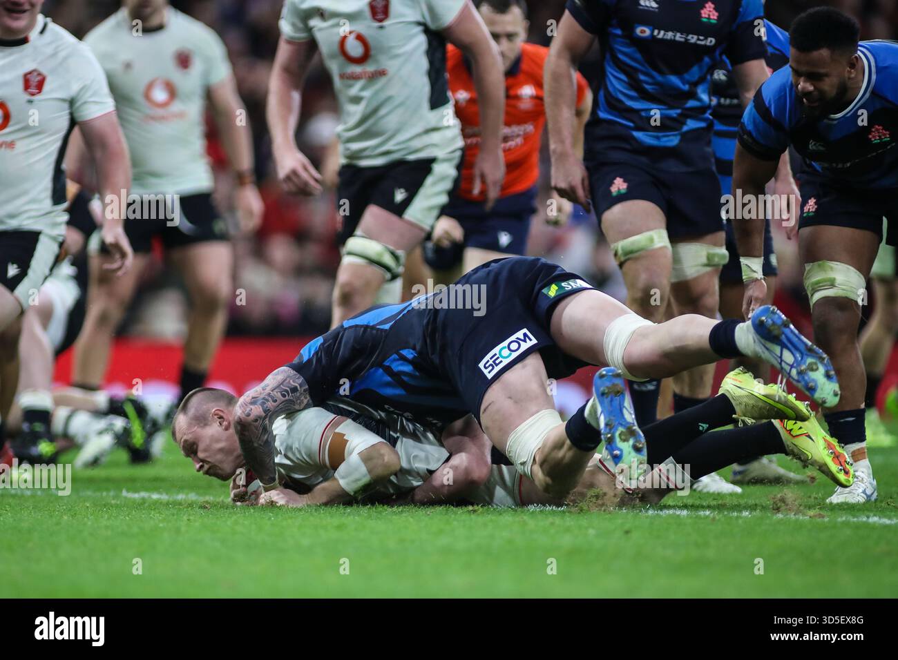 Nick Tompkins of Wales scores a try for his team during the Quilter ...