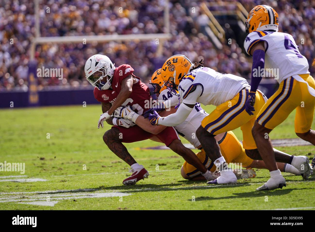 Arkansas wide receiver Raylen Sharpe (6) is tackled by LSU defensive ...
