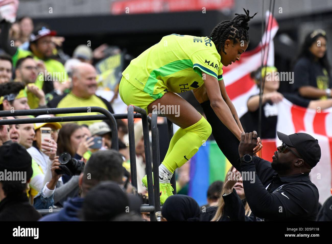 Washington Spirit midfielder Croix Bethune is helped out of the stands ...