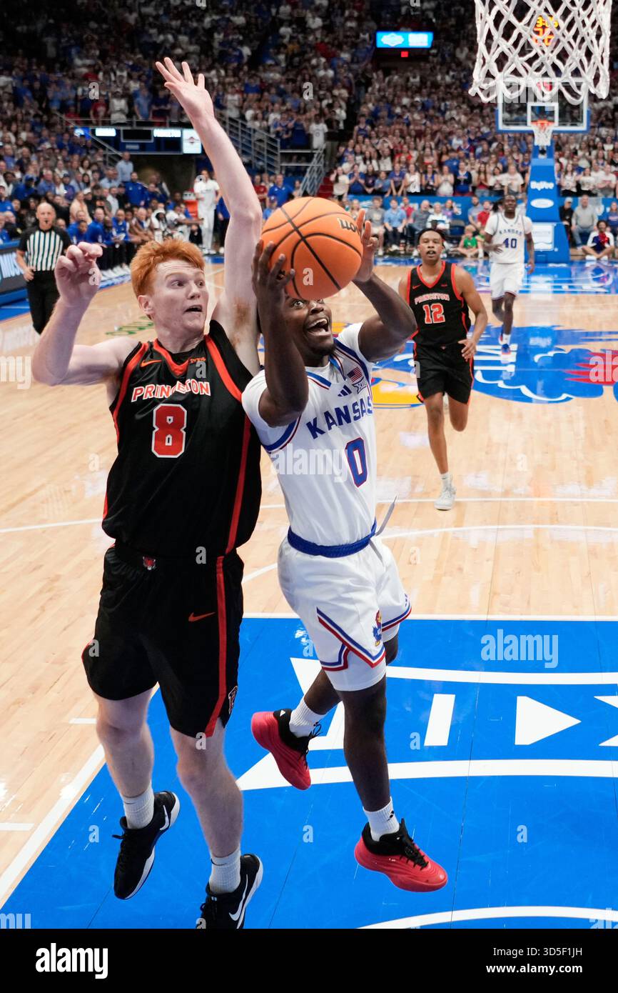 Kansas guard Nginyu Ngala (0) shoots under pressure from Princeton ...
