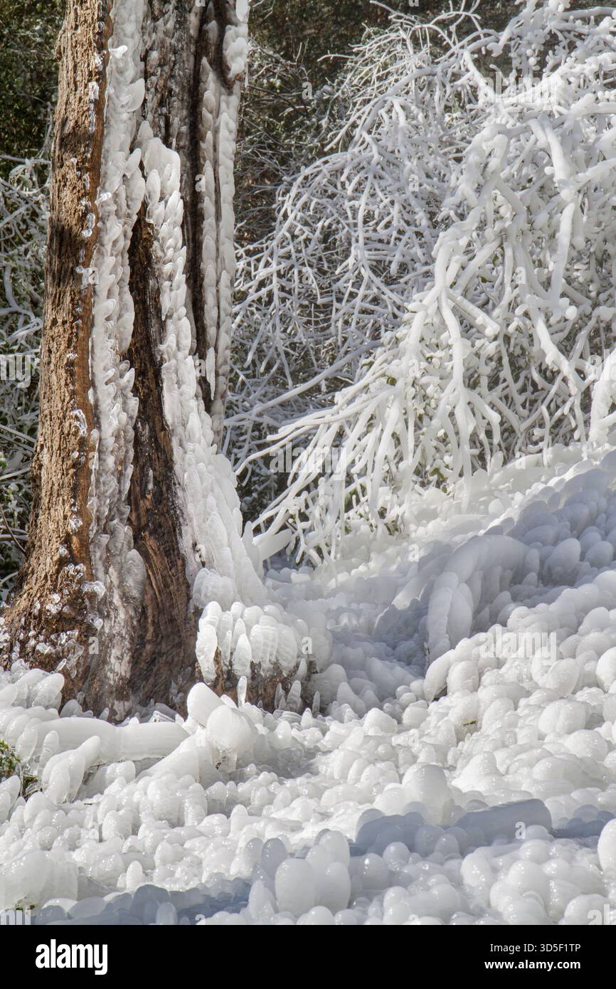 Frozen water drops and icing near a waterfall during winter, Toccoa ...