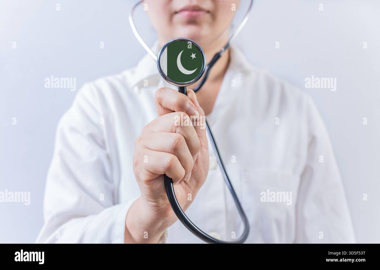 Female doctor holding stethoscope with Pakistan flag. National health ...