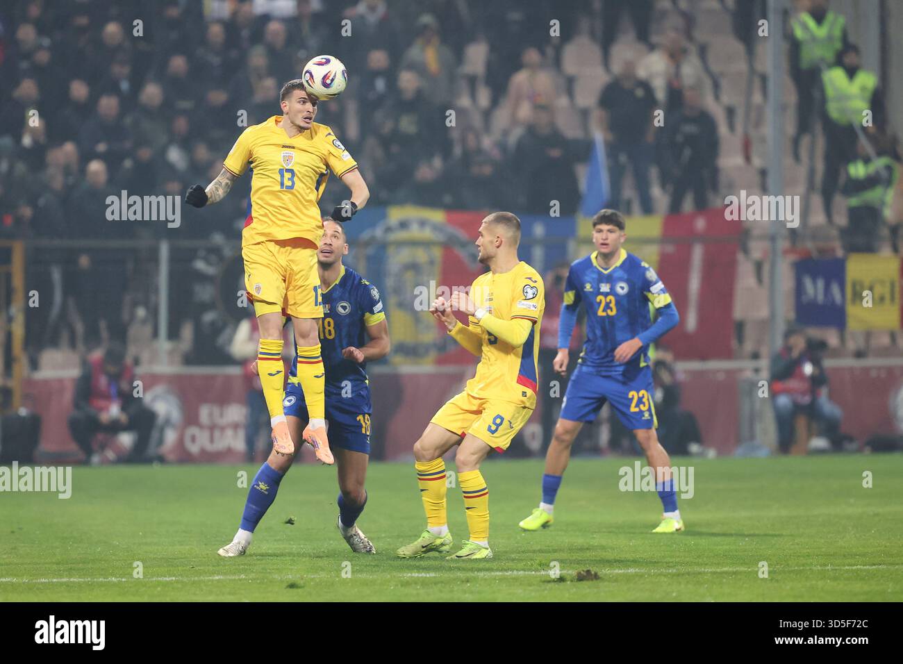 Romania's Valentin Mihaila heads the ball during the 2026 World Cup ...
