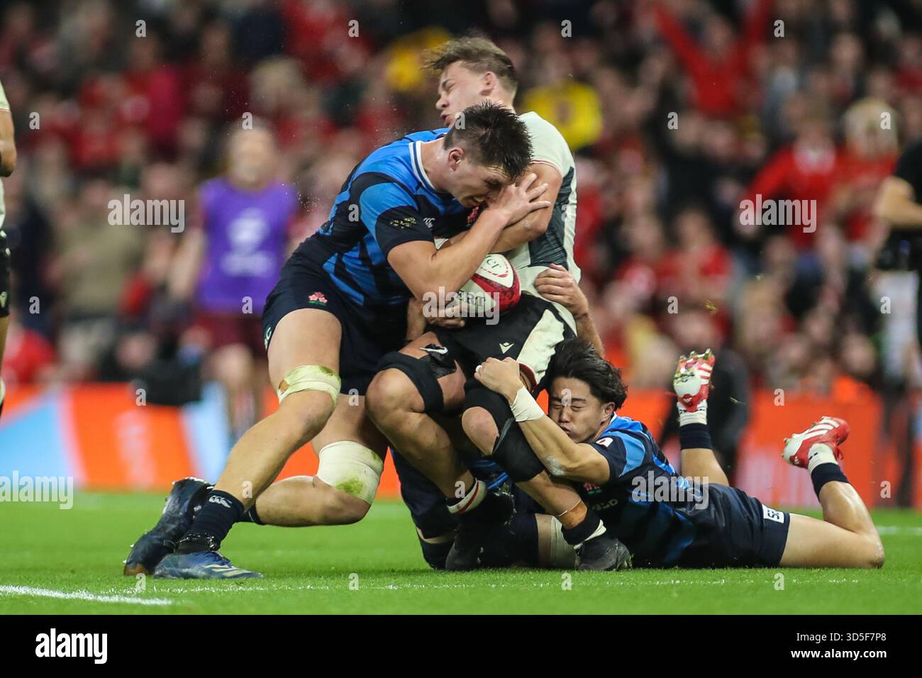 Alex Mann of Wales is tackled by Harry Hockings of Japan during the Quilter Nations Series 2025 ...