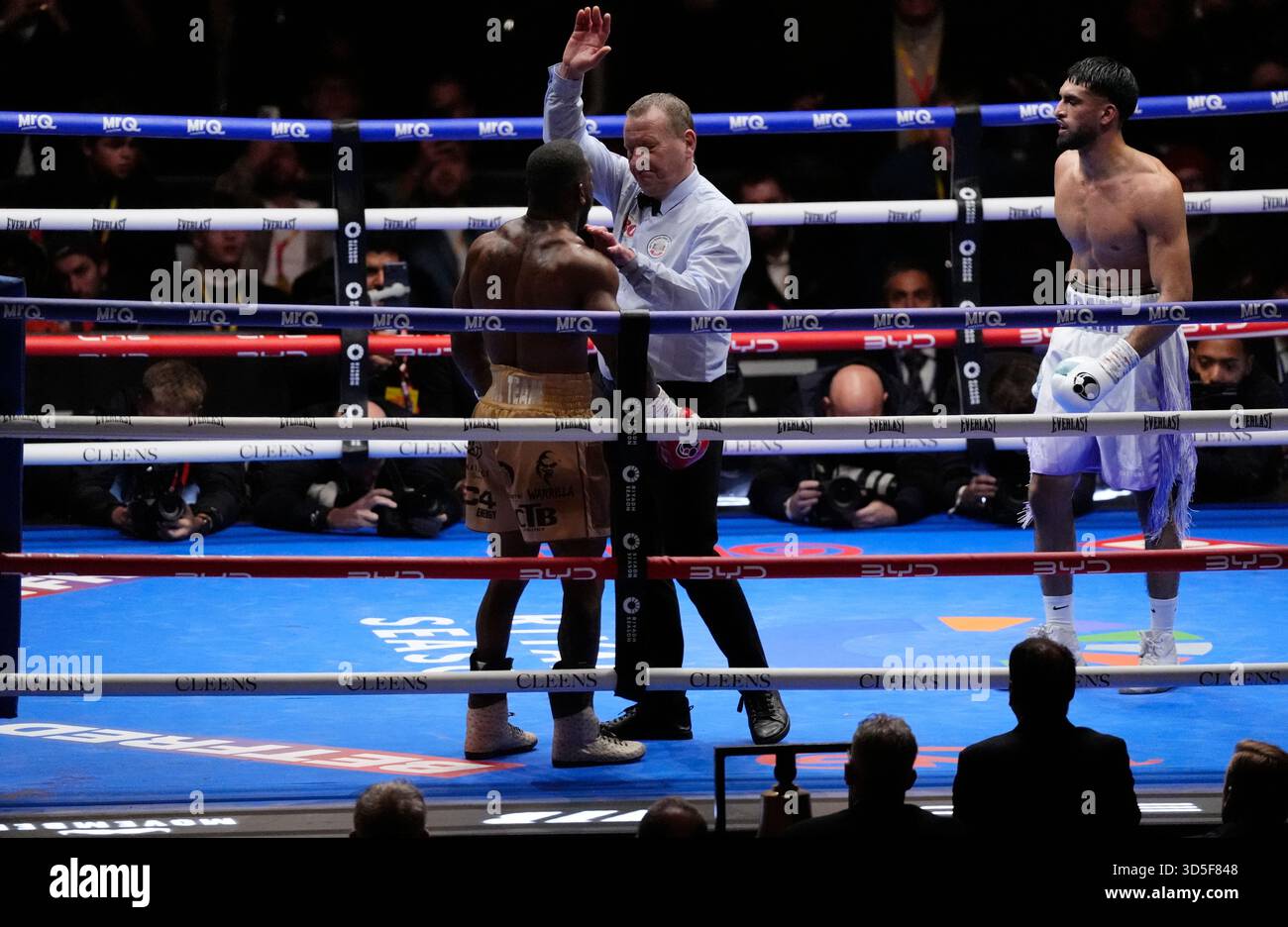 Referee Howard Foster waves off the fight between Adam Azim and Kurt ...