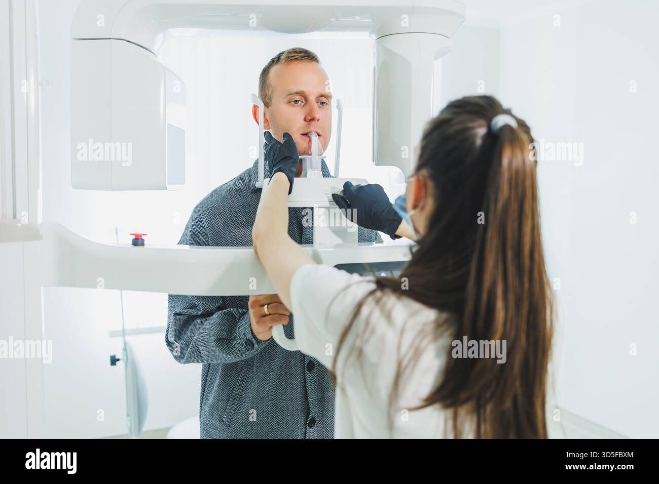 A young man underwent a CT scan of the jaw, a circular image of the jaw ...