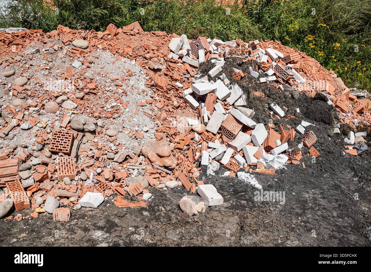 Heap of construction debris - broken pieces of bricks and concrete ...