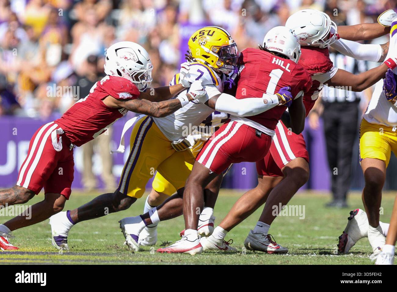 LSU Tigers linebacker Harold Perkins Jr. (7) tackles Arkansas ...