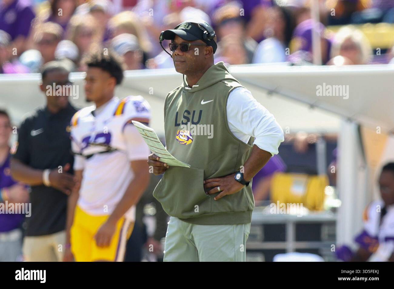 LSU Tigers head coach Frank Wilson III looks at his call sheet during a ...