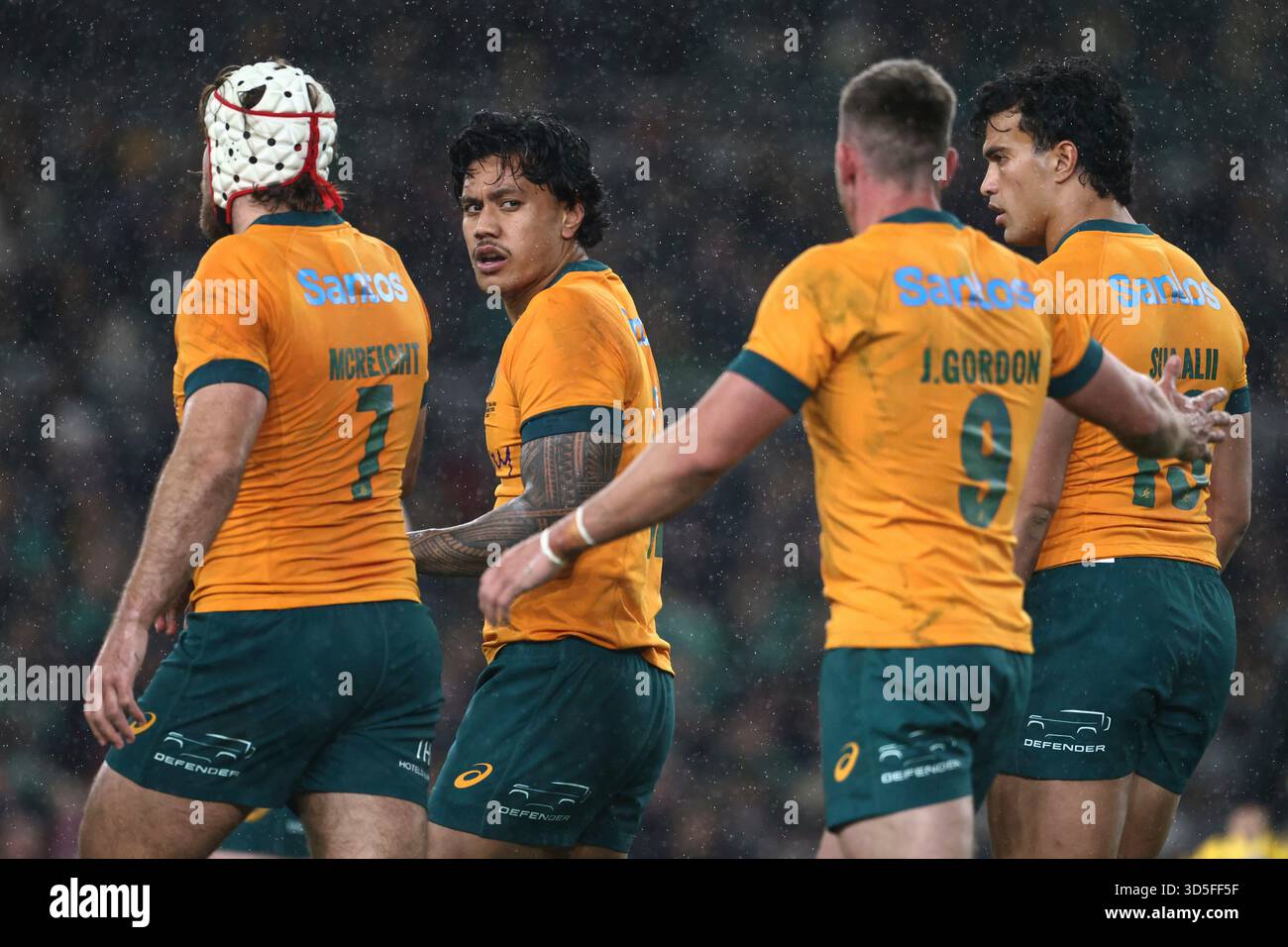 Australia's Len Ikitau, center, with teammates celebrates after scoring ...