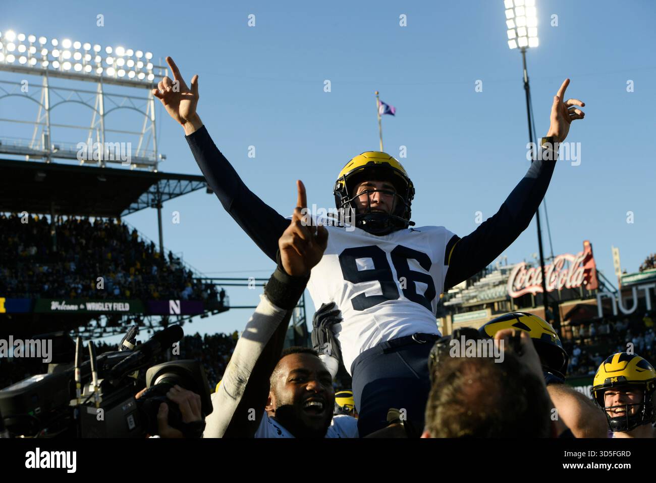 Michigan kicker Dominic Zvada (96) celebrates with teammates after ...