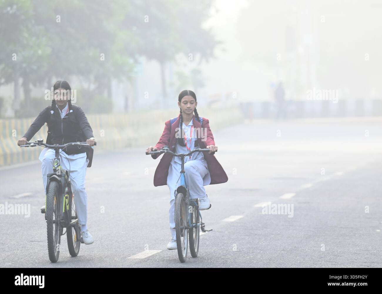 NOIDA, INDIA - NOVEMBER 15: Student came out wearing warm clothes on a ...