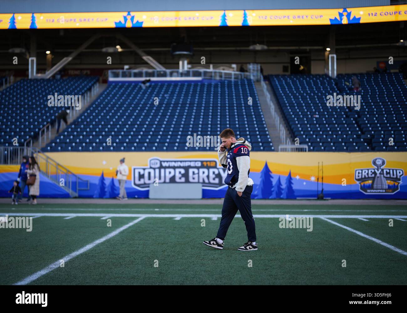 Montreal Alouettes quarterback Davis Alexander talks on the phone ...
