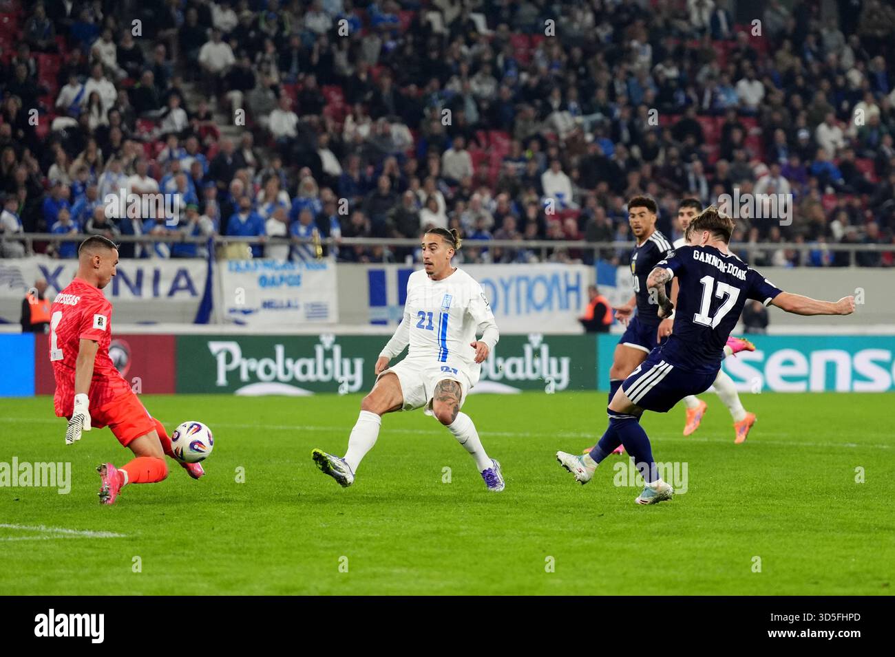 Greece goalkeeper Odisseas Vlachodimos (left) saves a shot from ...
