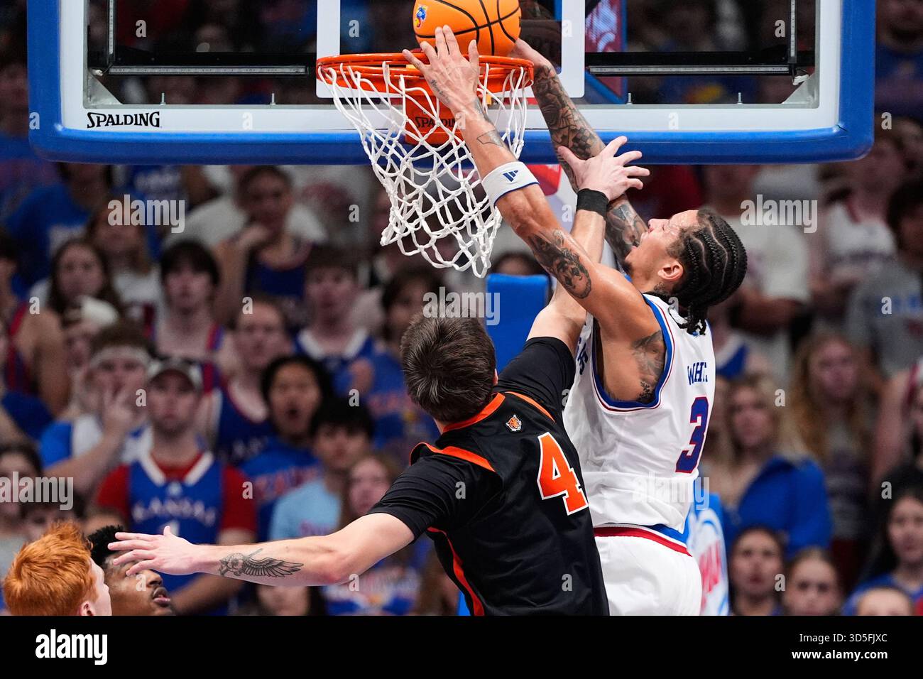 Kansas guard Tre White (3) puts up a shot under pressure from Princeton ...