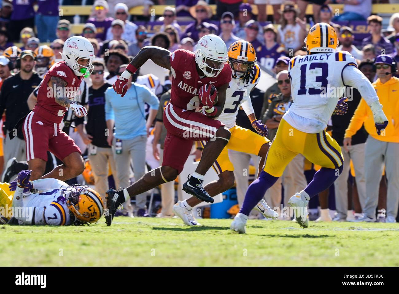 Arkansas running back Mike Washington (4) carries between LSU defensive ...