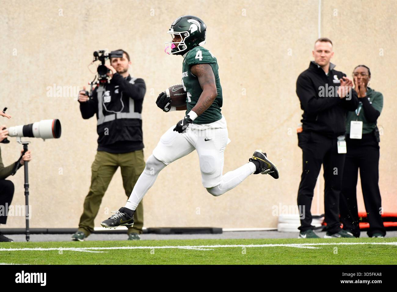 Michigan State running back Elijah Tau-Tolliver runs for a touchdown ...