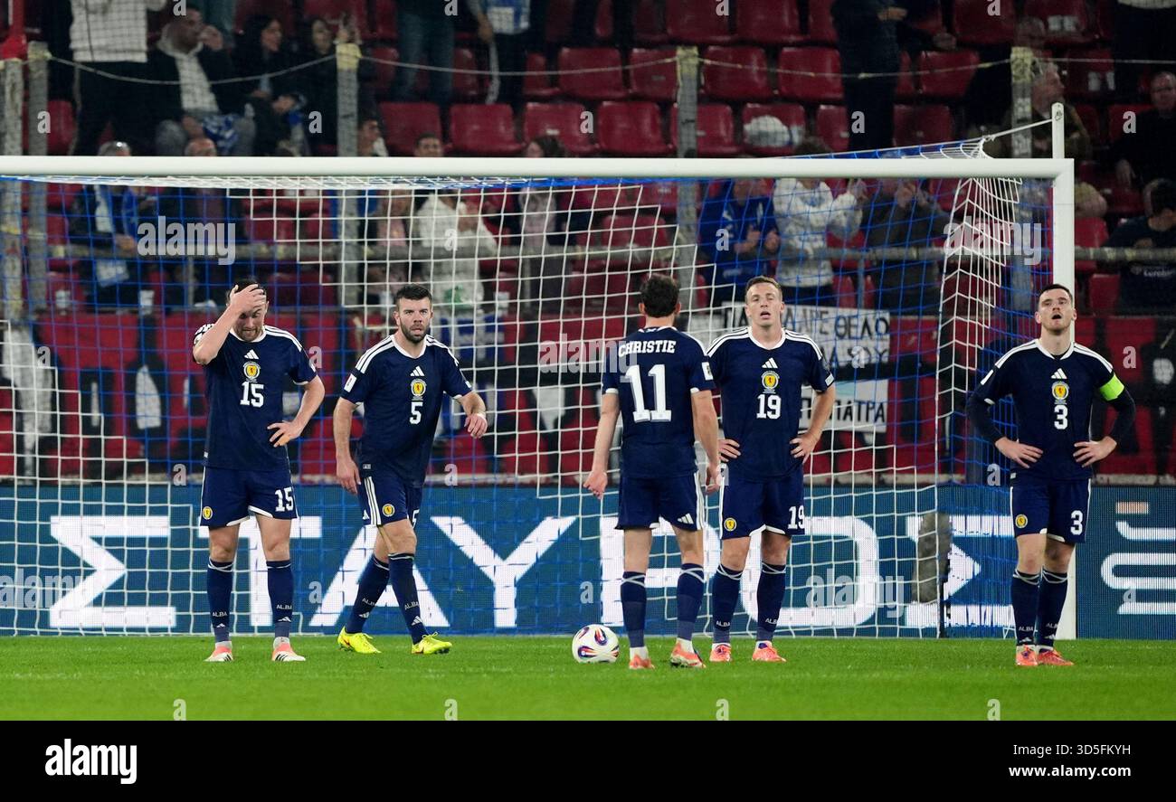 Scotland's players react after their side conceded a second goal during ...