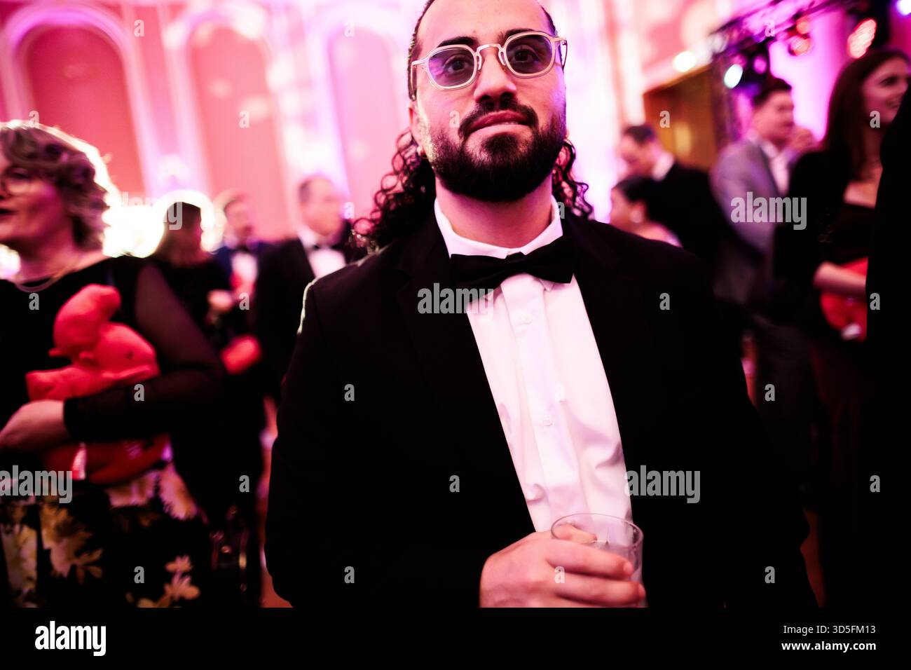 15 November 2025, Berlin: Guests stand at the Hip-Hop Ball in the Rotes ...