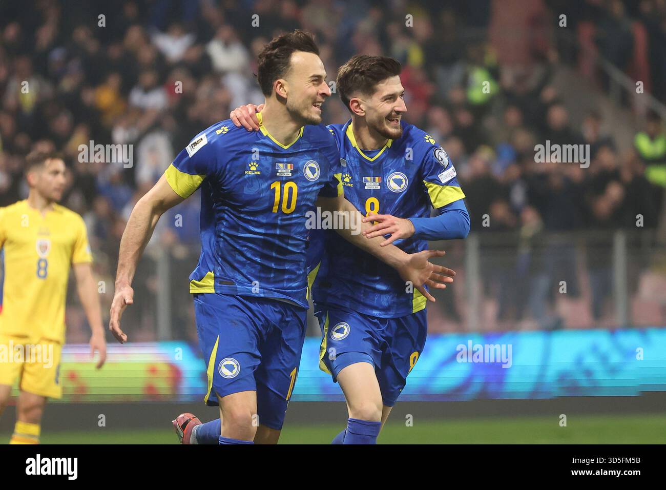 Bosnia's Haris Tabakovic, centre left, celebrates with Armin Gigovic ...