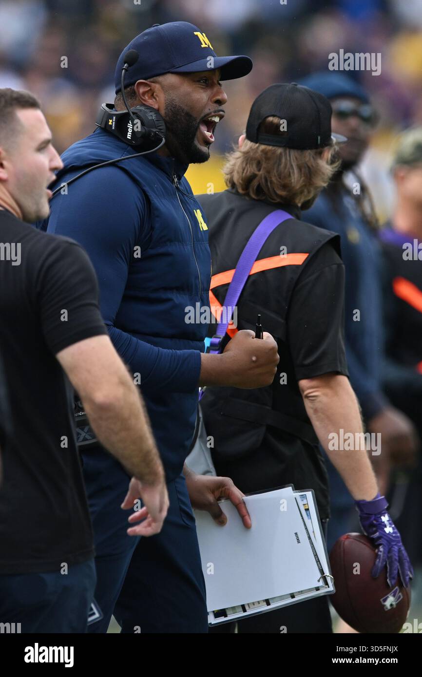 Michigan head coach Sherrone Moore, center, yells to his players during ...