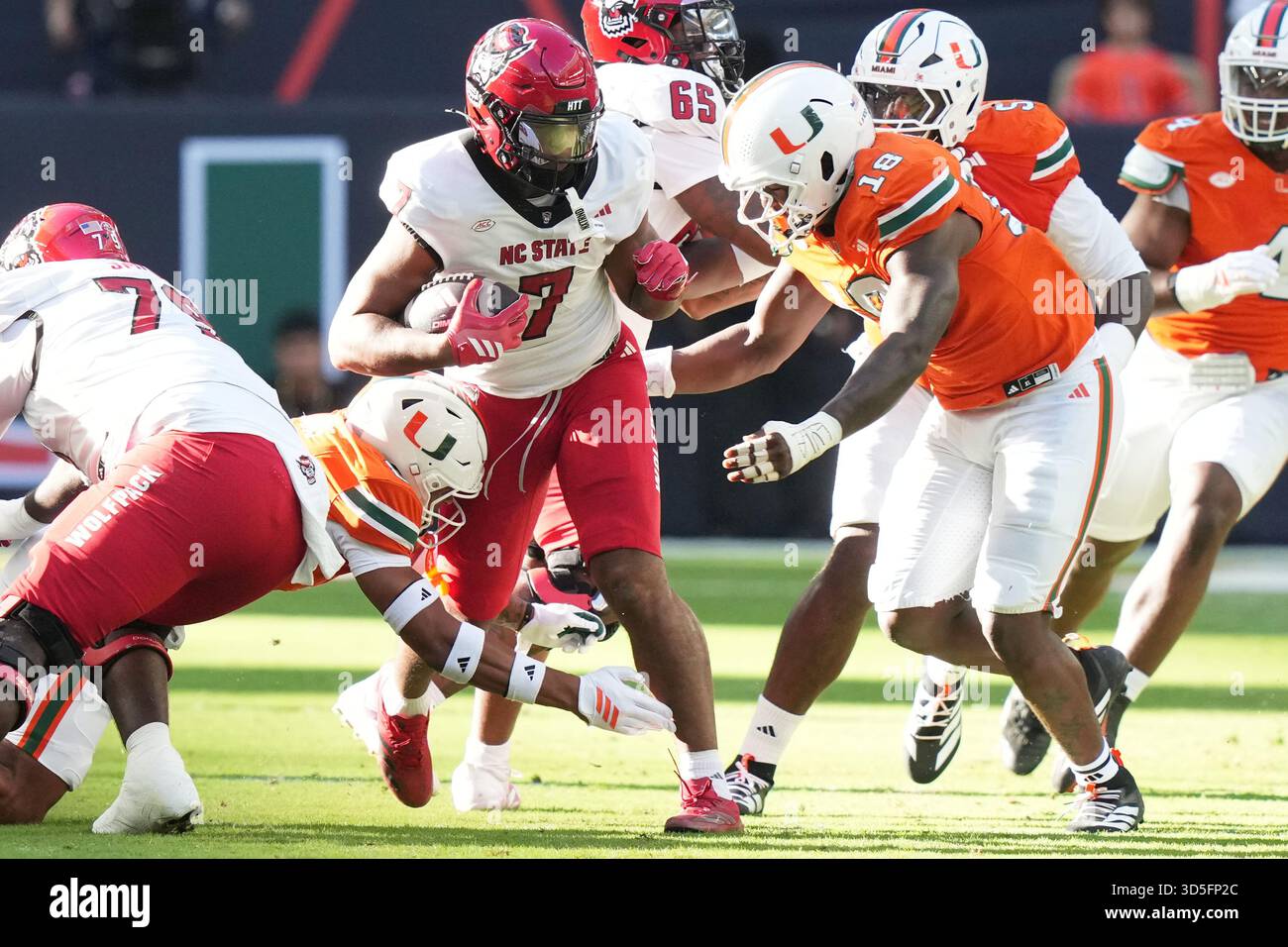 North Carolina State tight end Justin Joly (7) runs as Miami defensive ...