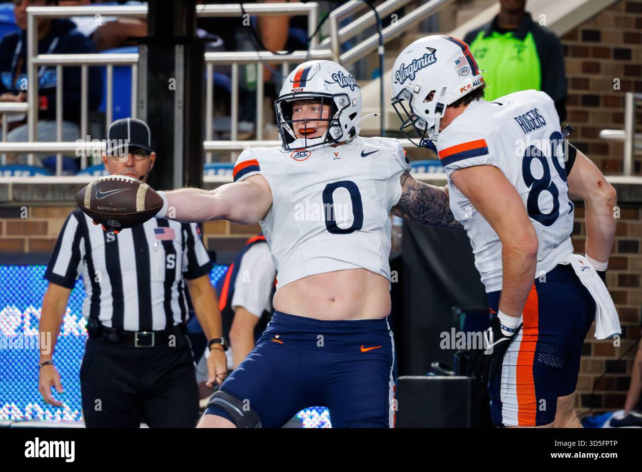 Virginia's Sage Ennis (0) celebrates with John Rogers (89) after ...
