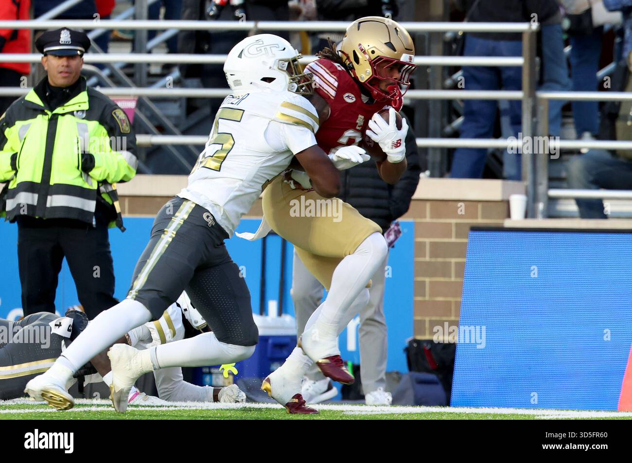Georgia Tech linebacker Tah'J Butler, left, tackles Boston College running back Turbo Richard ...