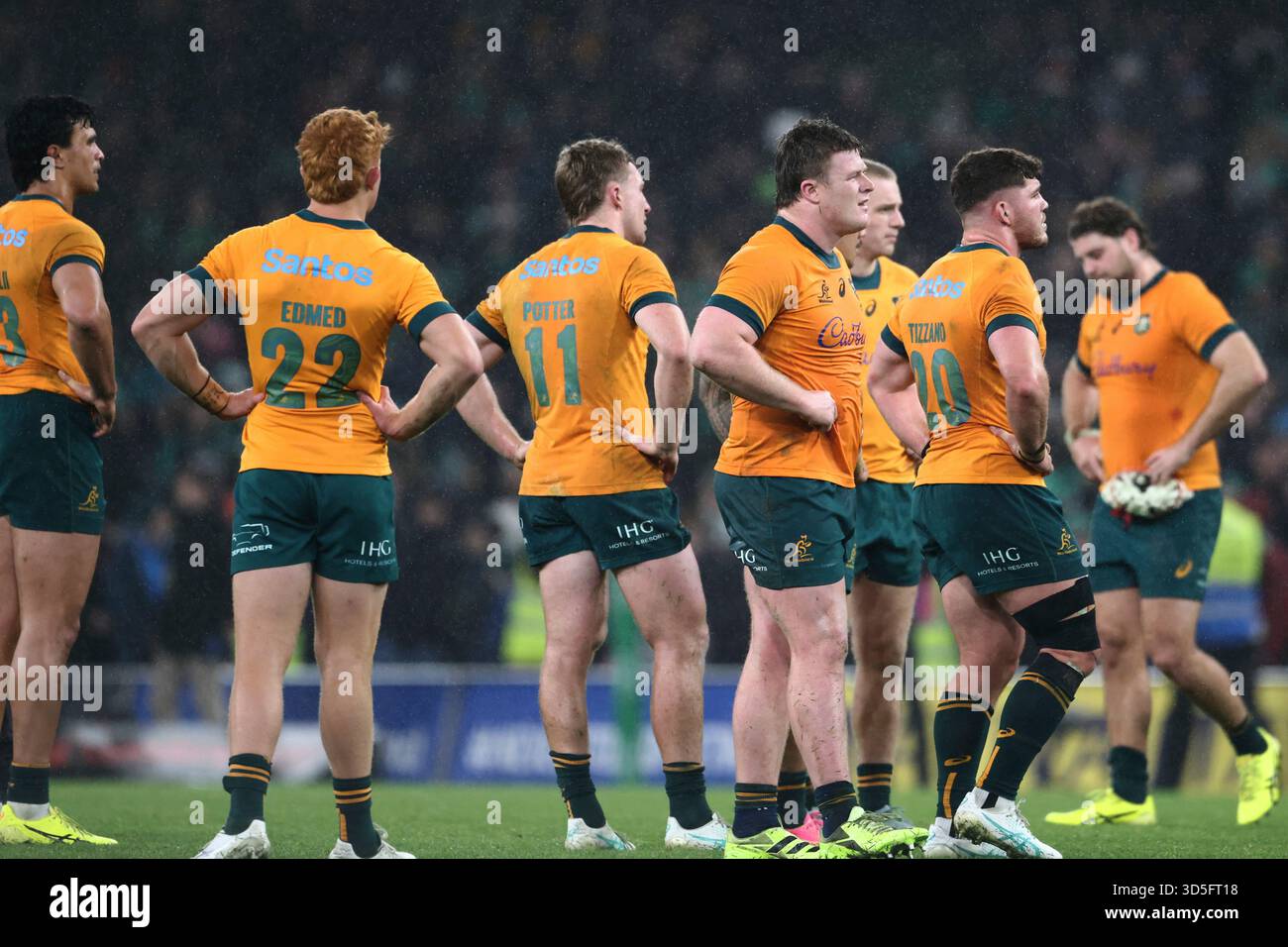 Australia's players stand dejected following the rugby union Nations ...