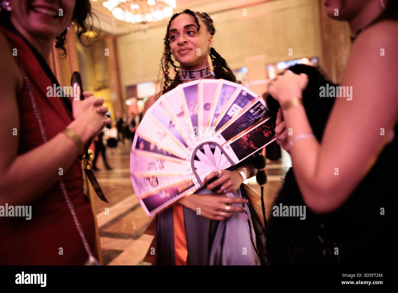 15 November 2025, Berlin: Guests stand at the Hip-Hop Ball in the Rotes ...