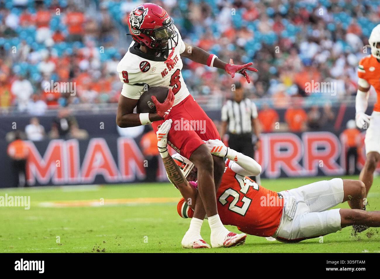 North Carolina State wide receiver Terrell Anderson (9) is tackled by ...