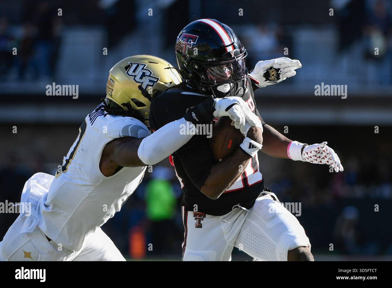 Texas Tech running back J'Koby Williams, right, is tackled by Central ...