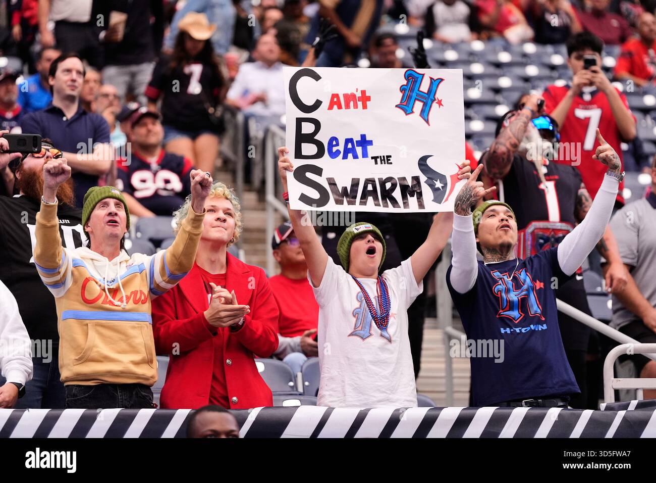 Houston Texans fans cheer during an NFL football game against the ...