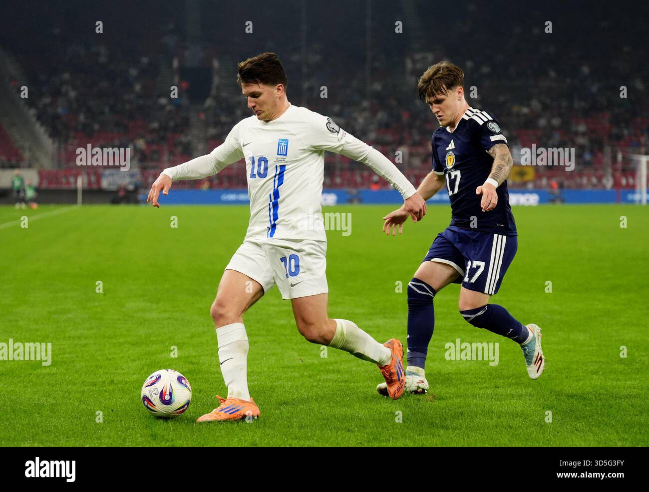 Greece's Christos Tzolis (left) and Scotland's Ben Doak battle for the ...