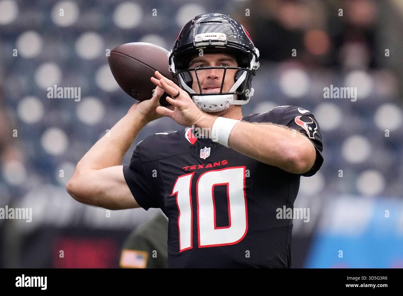 Houston Texans quarterback Davis Mills warms up before an NFL football ...